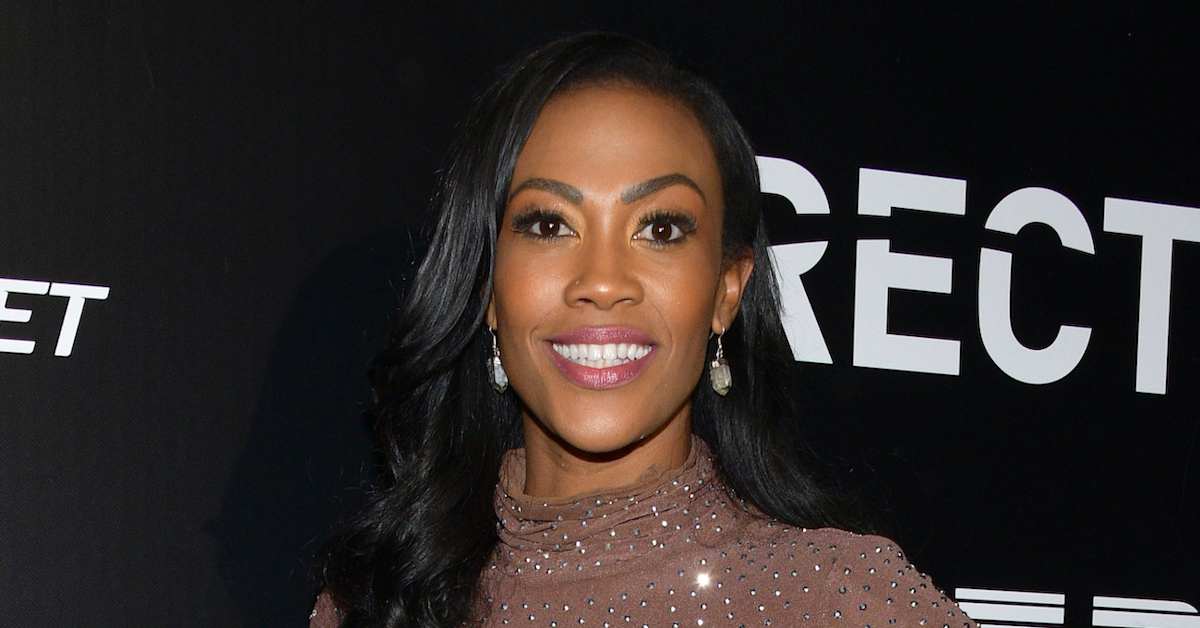 Kim Glass Lounges Oceanside in a Strapless White One-Piece with Daring ...